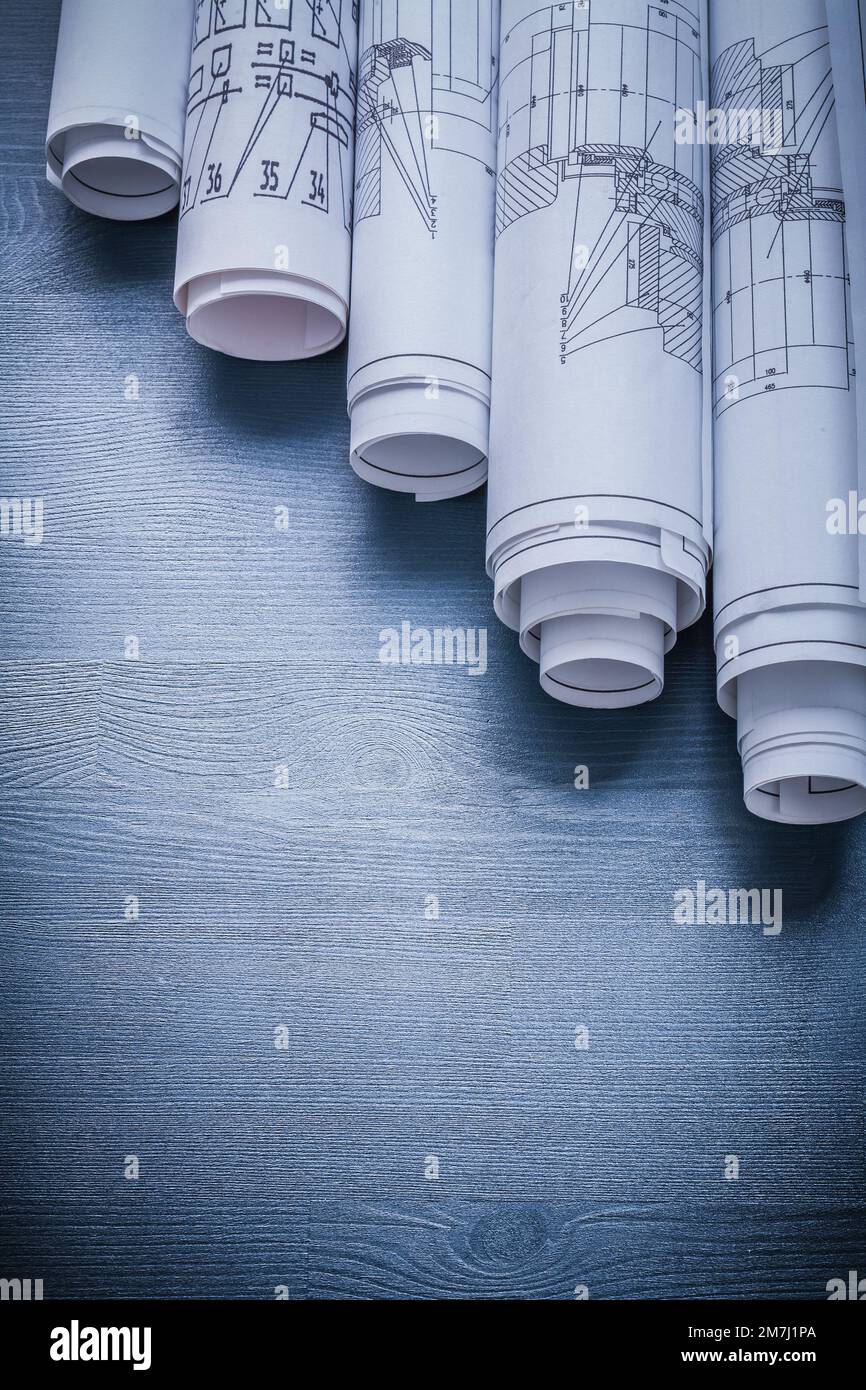 vertical view copyspace image rolls of blueprints on blue board Stock ...