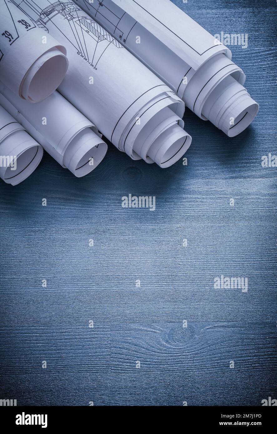 vertical view stack of rolled blueprints on board Stock Photo - Alamy