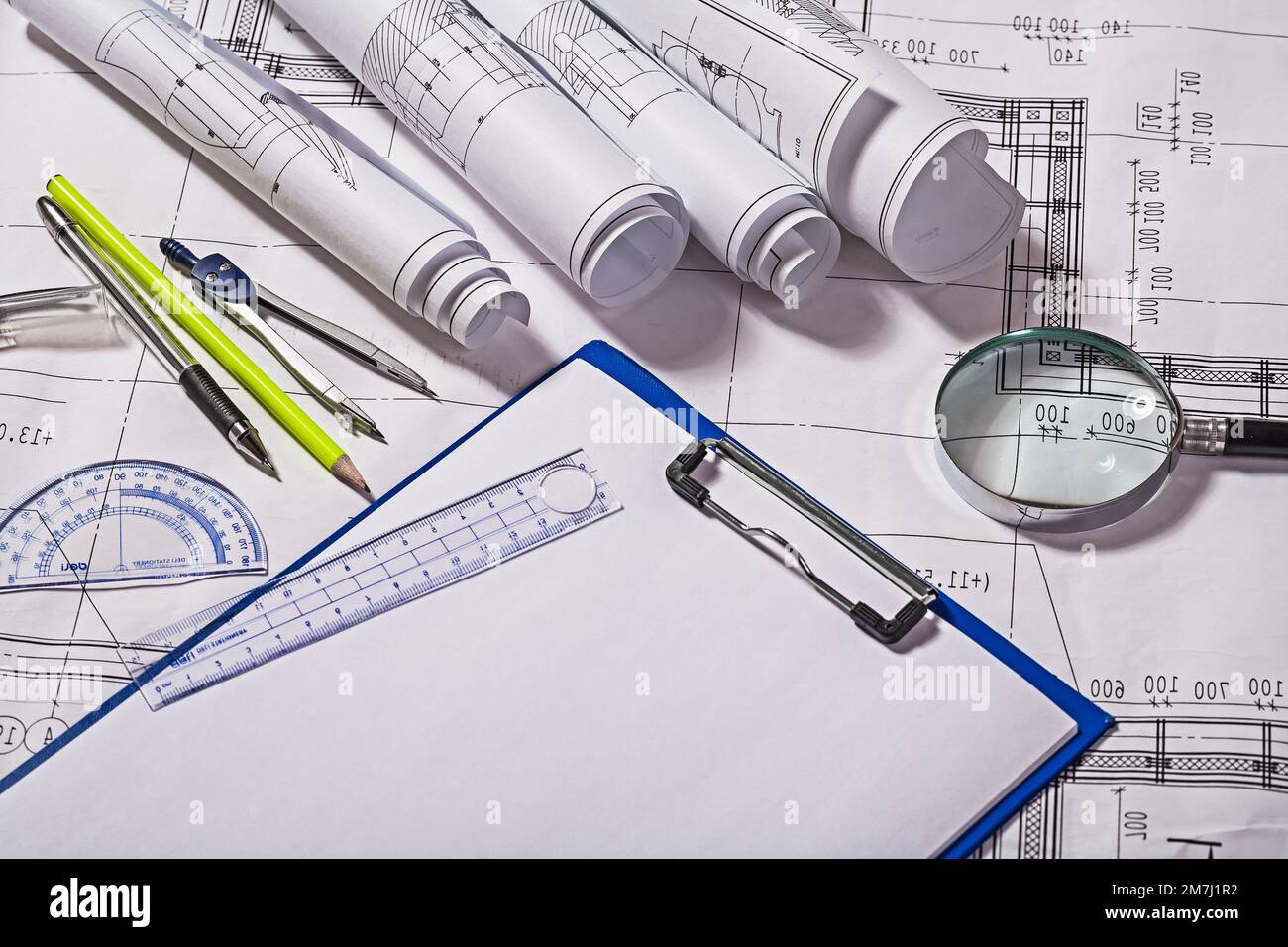 view on drawing tools with blueprints Stock Photo - Alamy