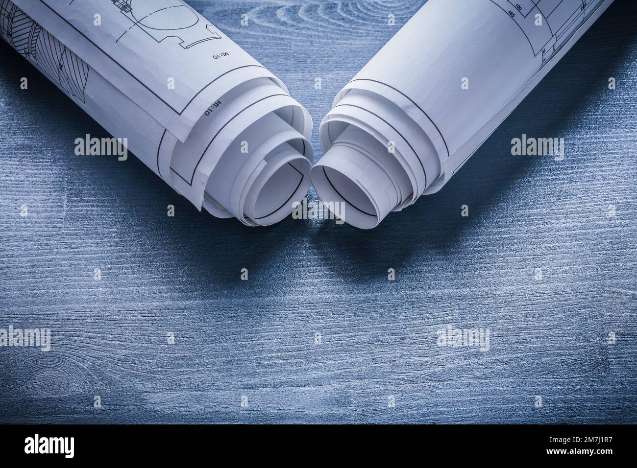 view on two white rolls of blueprints Stock Photo - Alamy