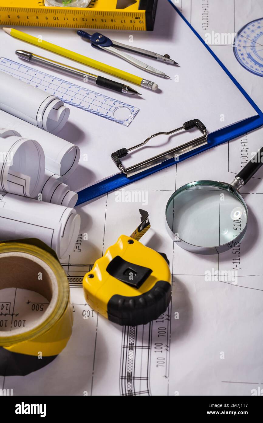Wiew on a typical engineer workplace with blueprint and measuring tools ...