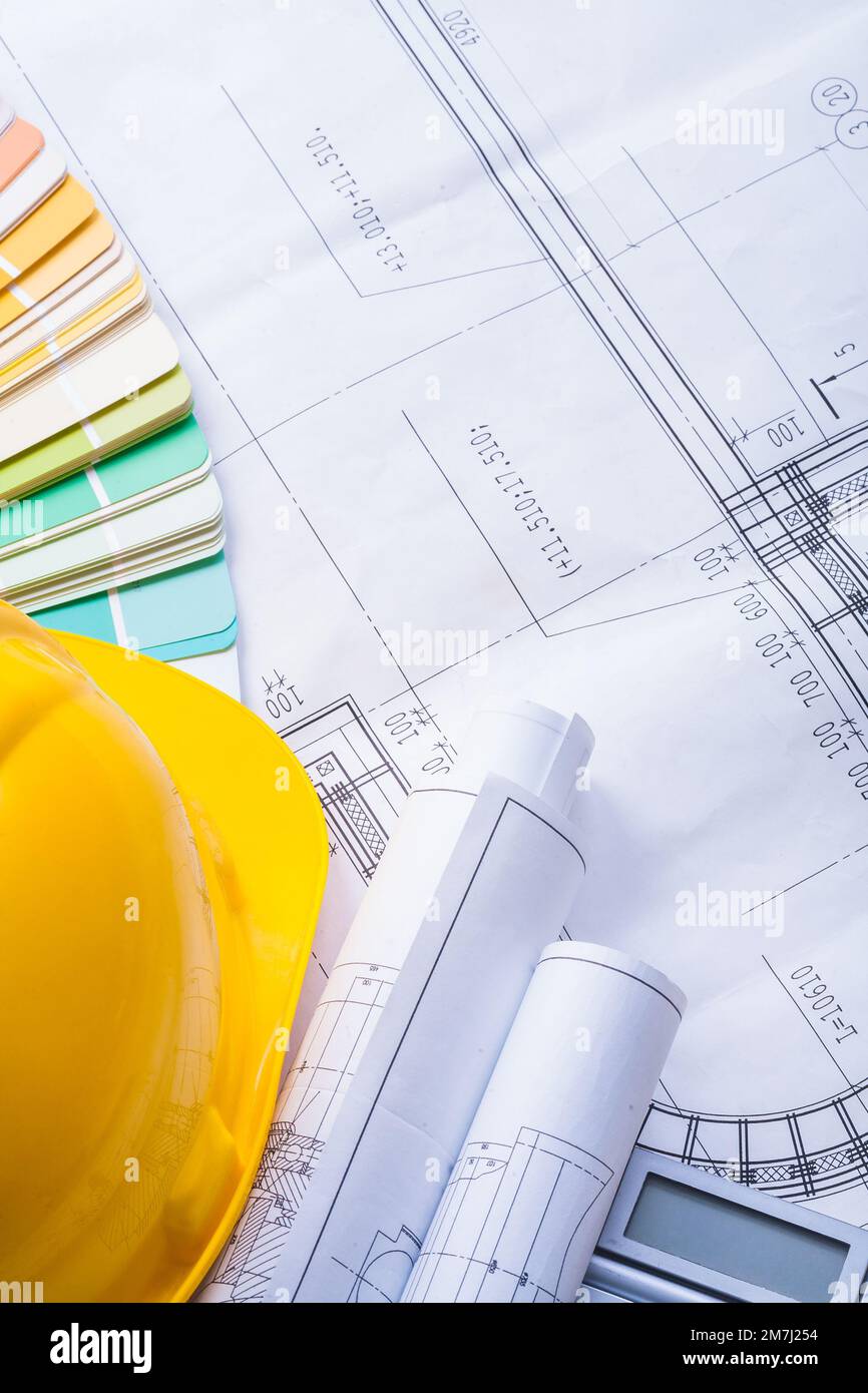 yellow helmet rolled blueprints color palette with copyspace Stock ...