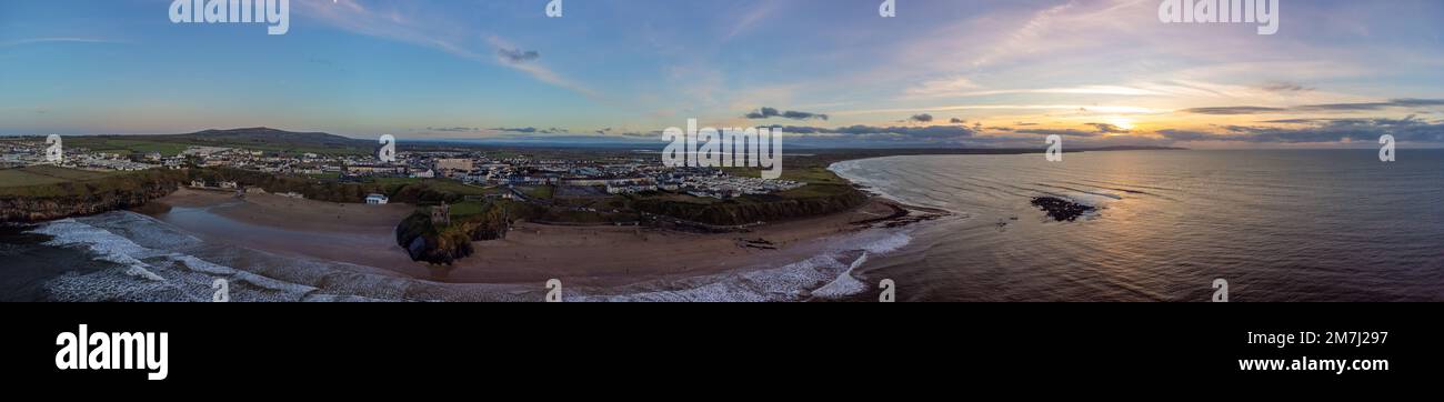 An aerial panoramic view of of Ballybunion, Ireland with beaches, town ...
