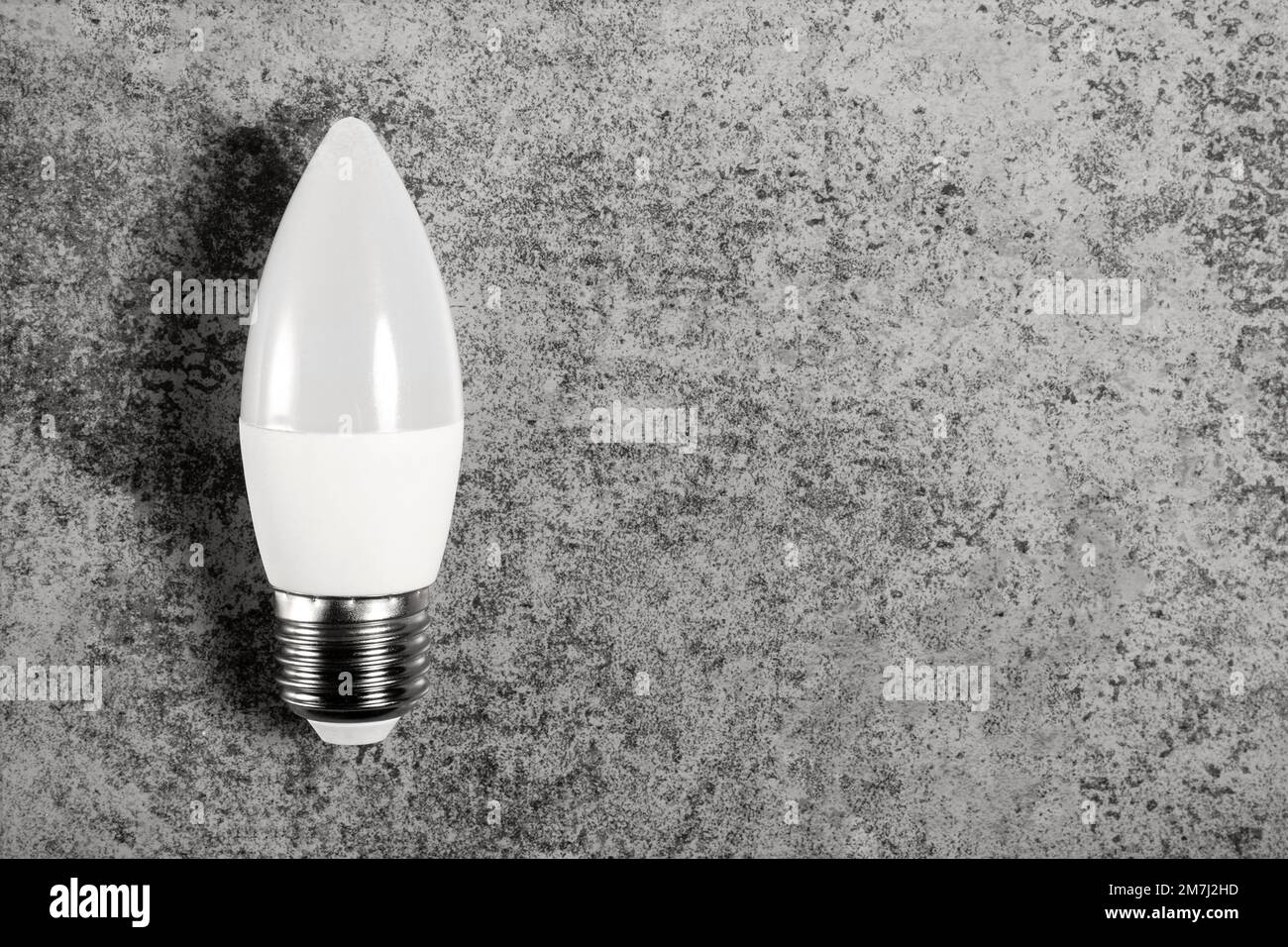 LED energy-saving lamp with E27 screw cap base in form of candle, on ...