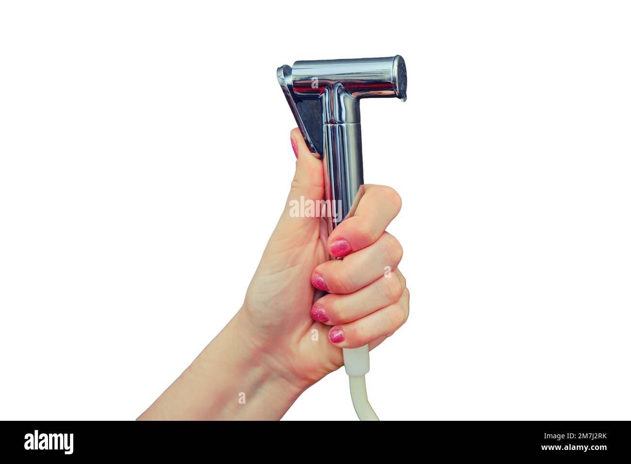 Hygienic shower in the hand of a woman against a stone wall, copy space ...