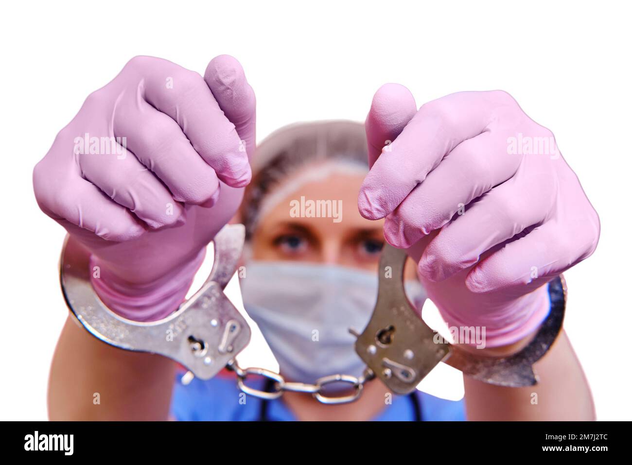 Doctor shows hands in handcuffs on , closeup, isolated on a white ...