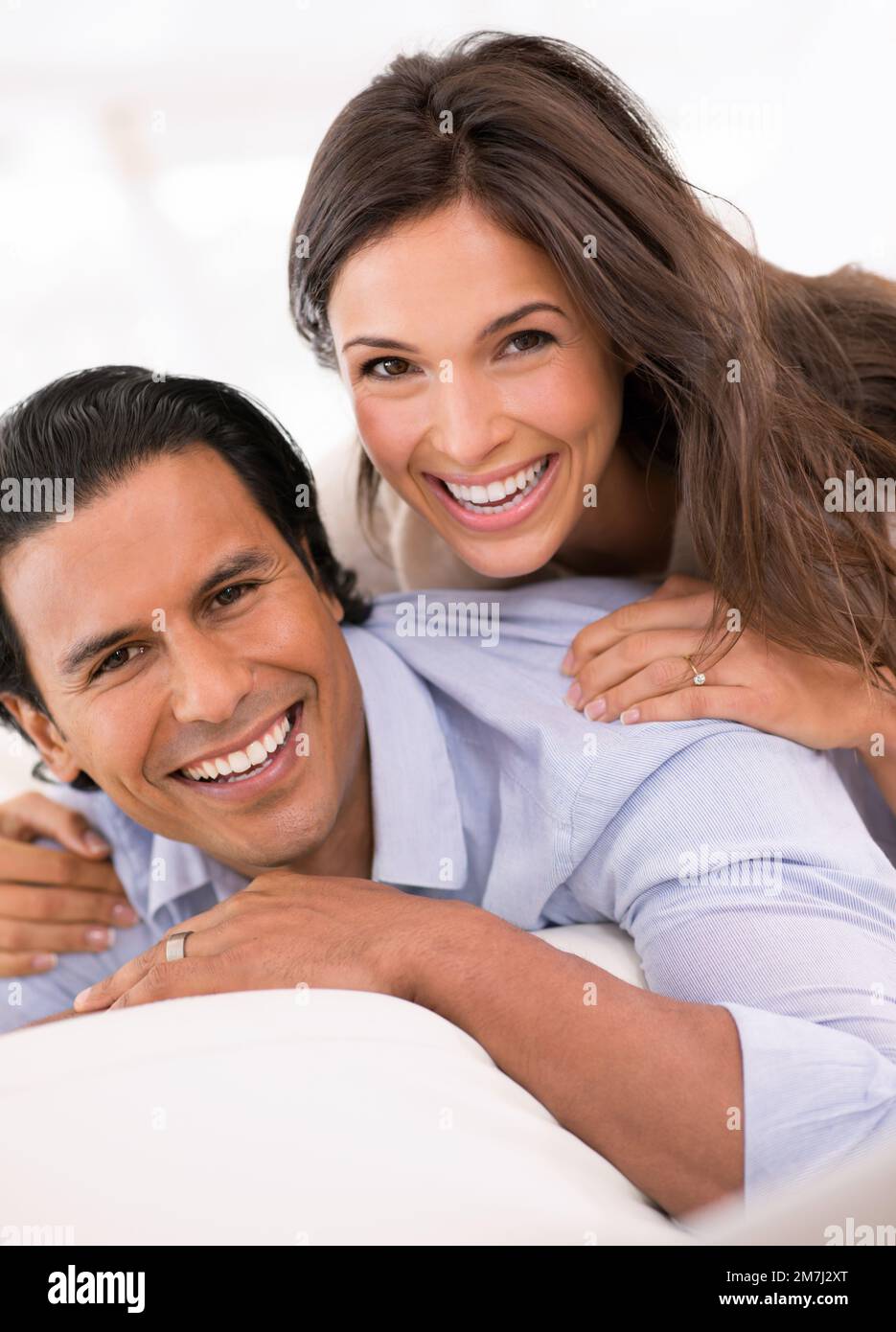 Brunette woman lying on couch hi-res stock photography and images - Alamy