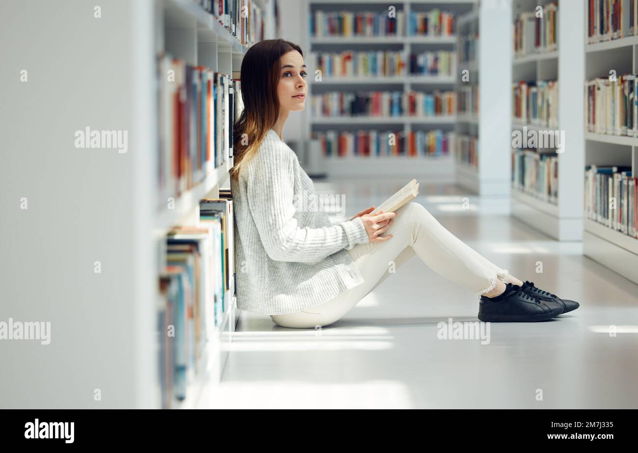 Education, library and woman reading a book, college learning and ...