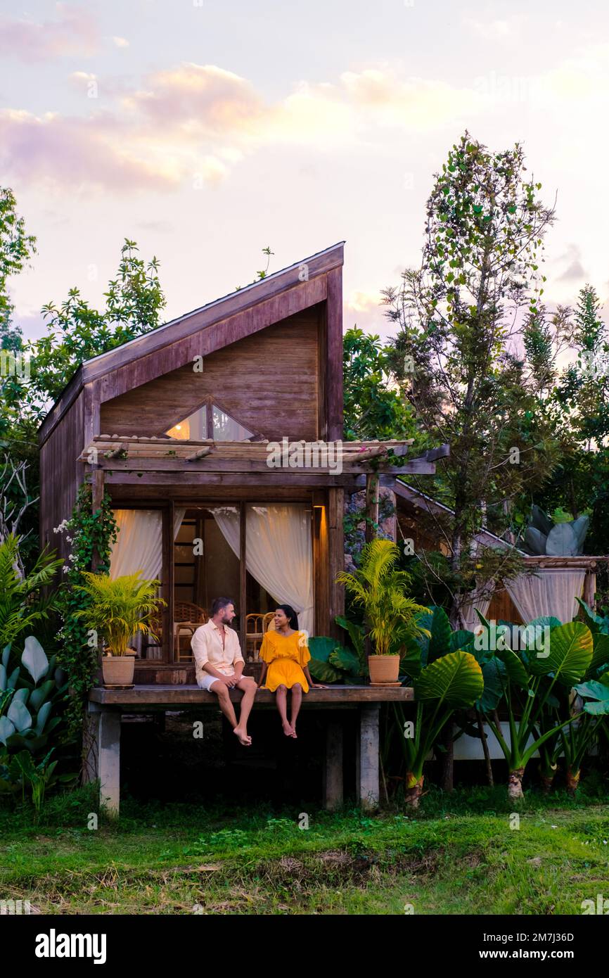 A couple of men and women at a cottage homestay in Northern Thailand ...