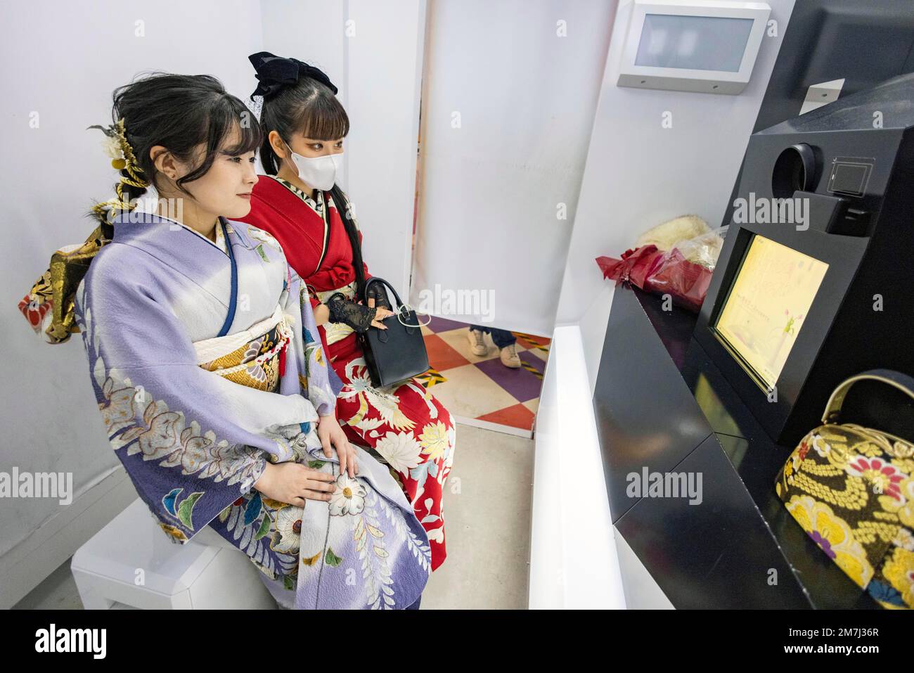 pic shows: Inside a Purikura photo booth with two young women On Coming ...