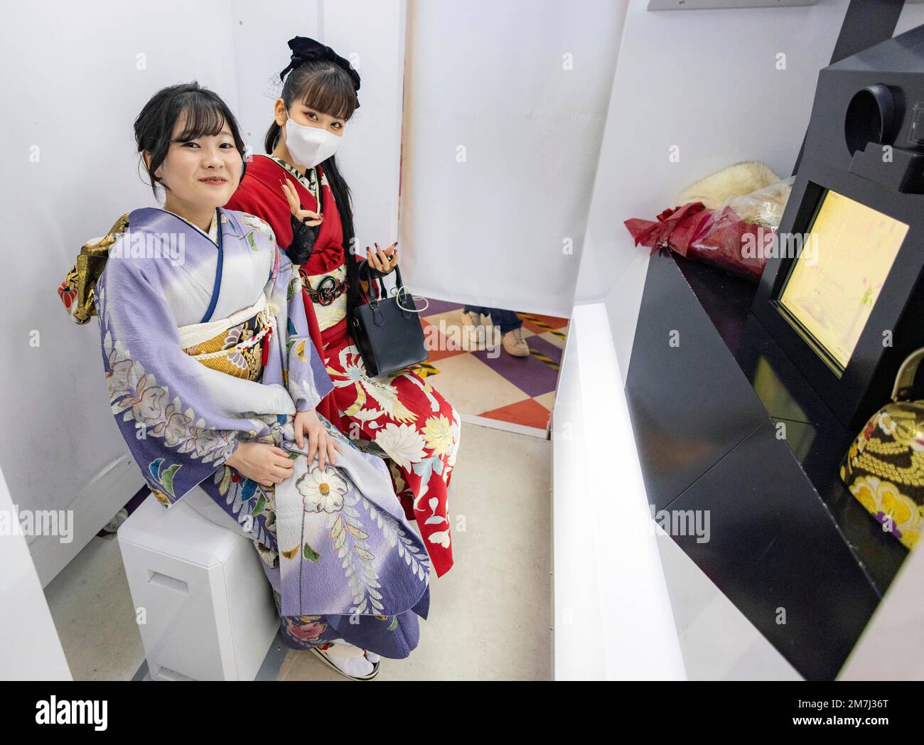 pic shows: Inside a Purikura photo booth with two young women On Coming ...