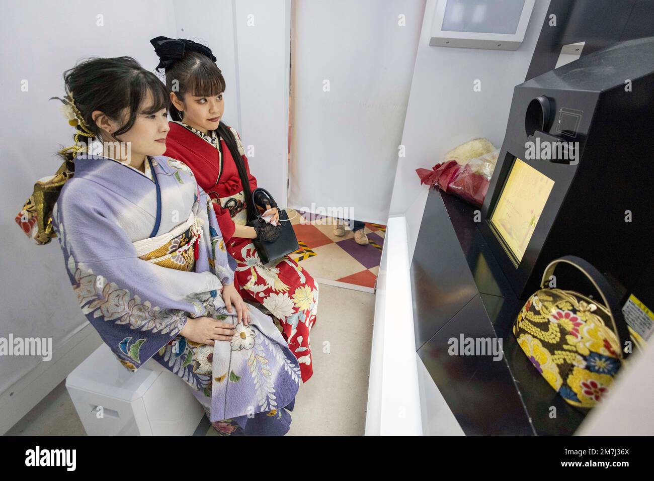 pic shows: Inside a Purikura photo booth with two young women On Coming ...