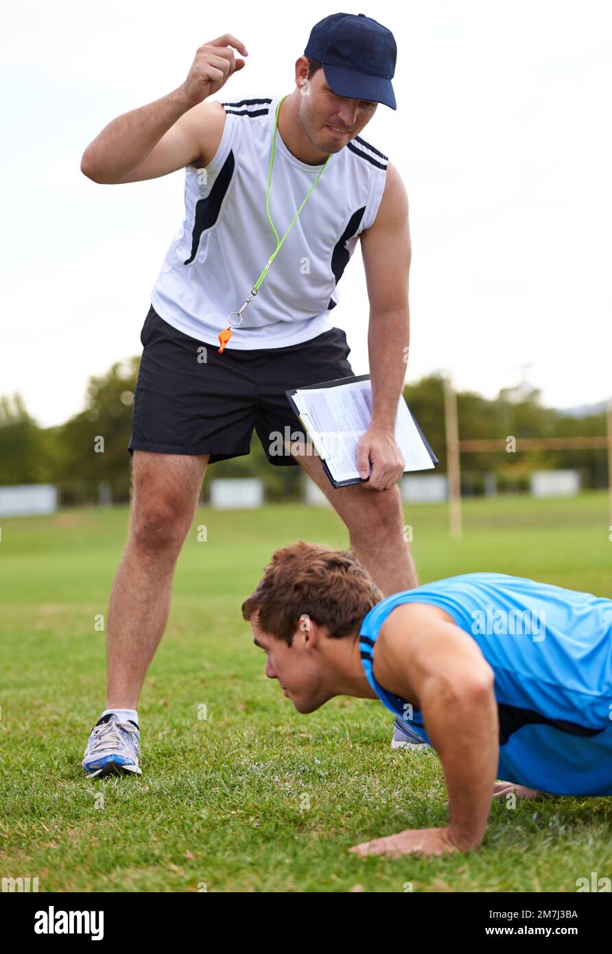 Sometimes coach gets a bit carried away...a young man training with his ...