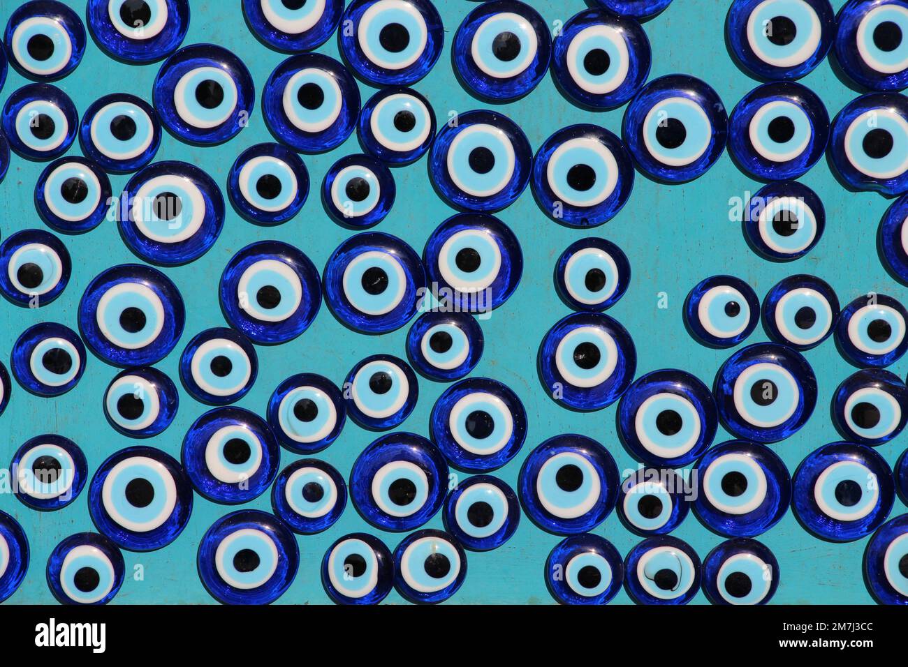 Blue evil eye beads, background. Traditional glass art produced in ...