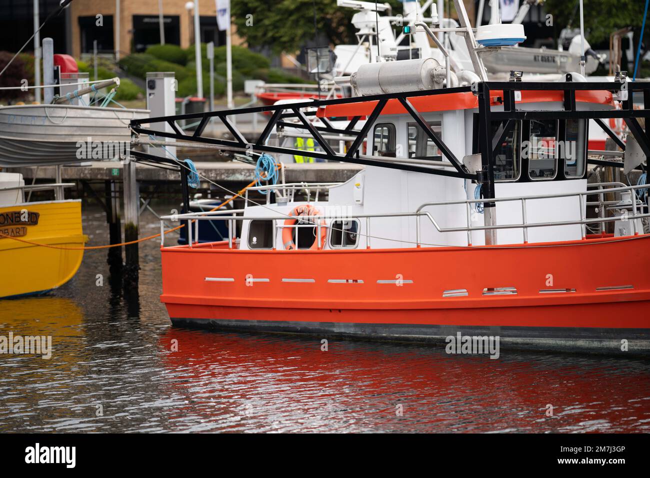 fishing boat moored to a buoy in a marina in spring in summer Stock ...