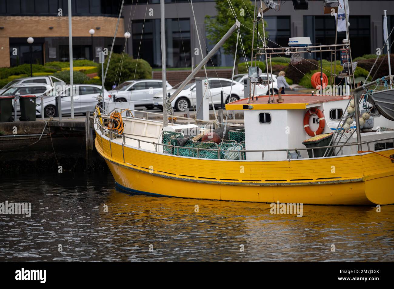fishing boat moored to a buoy in a marina in spring in summer Stock ...