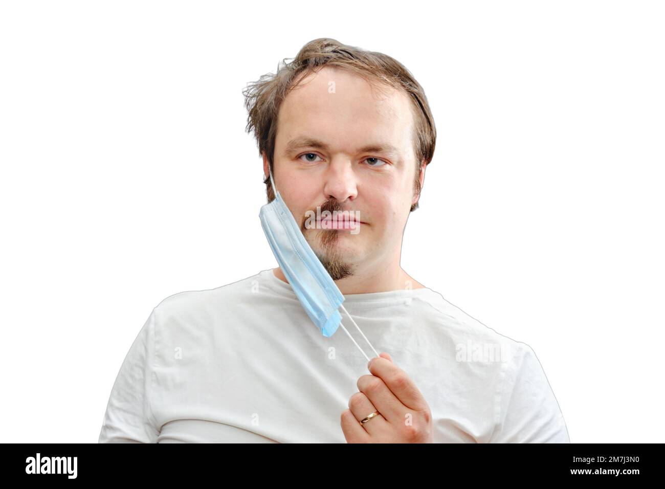The man removes the medical mask under which the half-shaved beard and ...