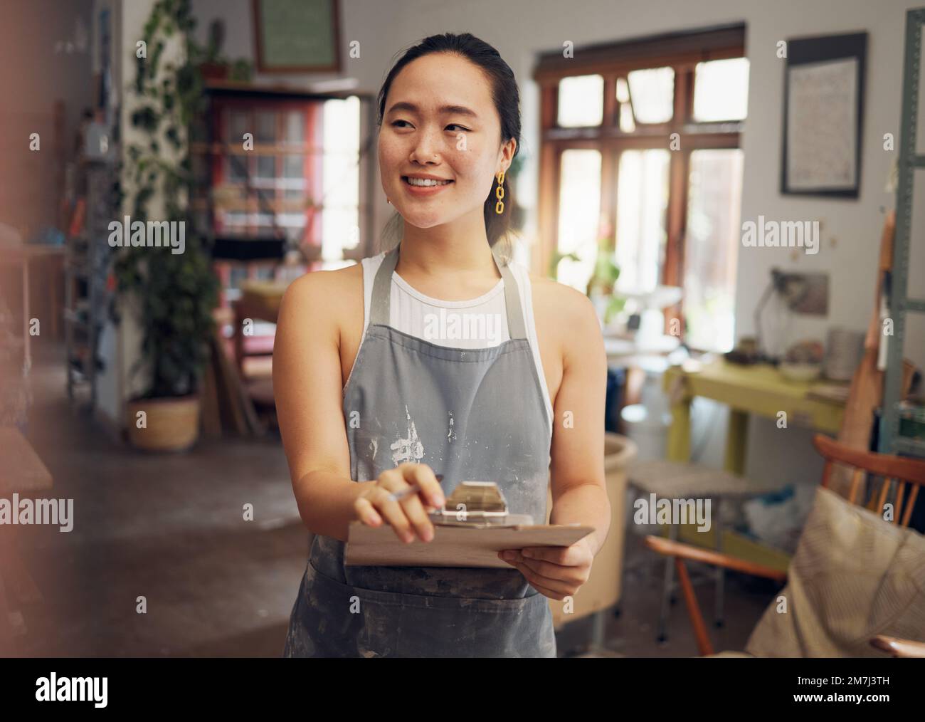 Asian woman, clipboard and creative business owner with smile for art ...