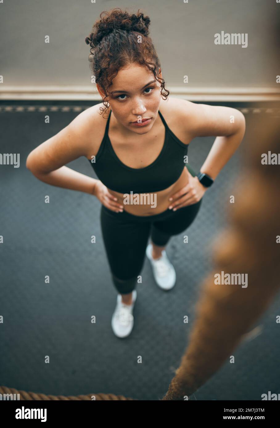 Rope climbing, gym and fitness of woman ready for sports challenge ...