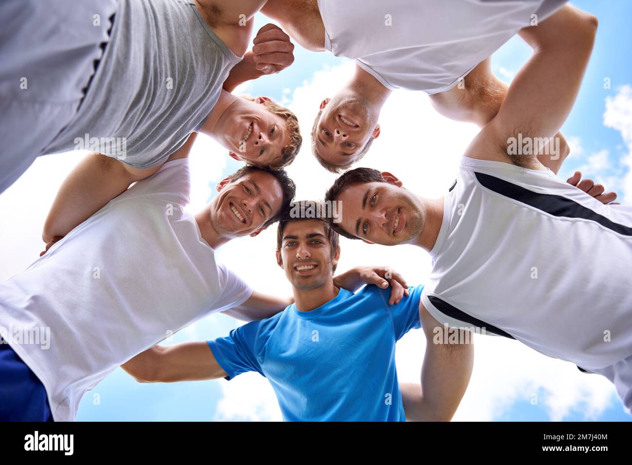 Group huddle men hi-res stock photography and images - Alamy