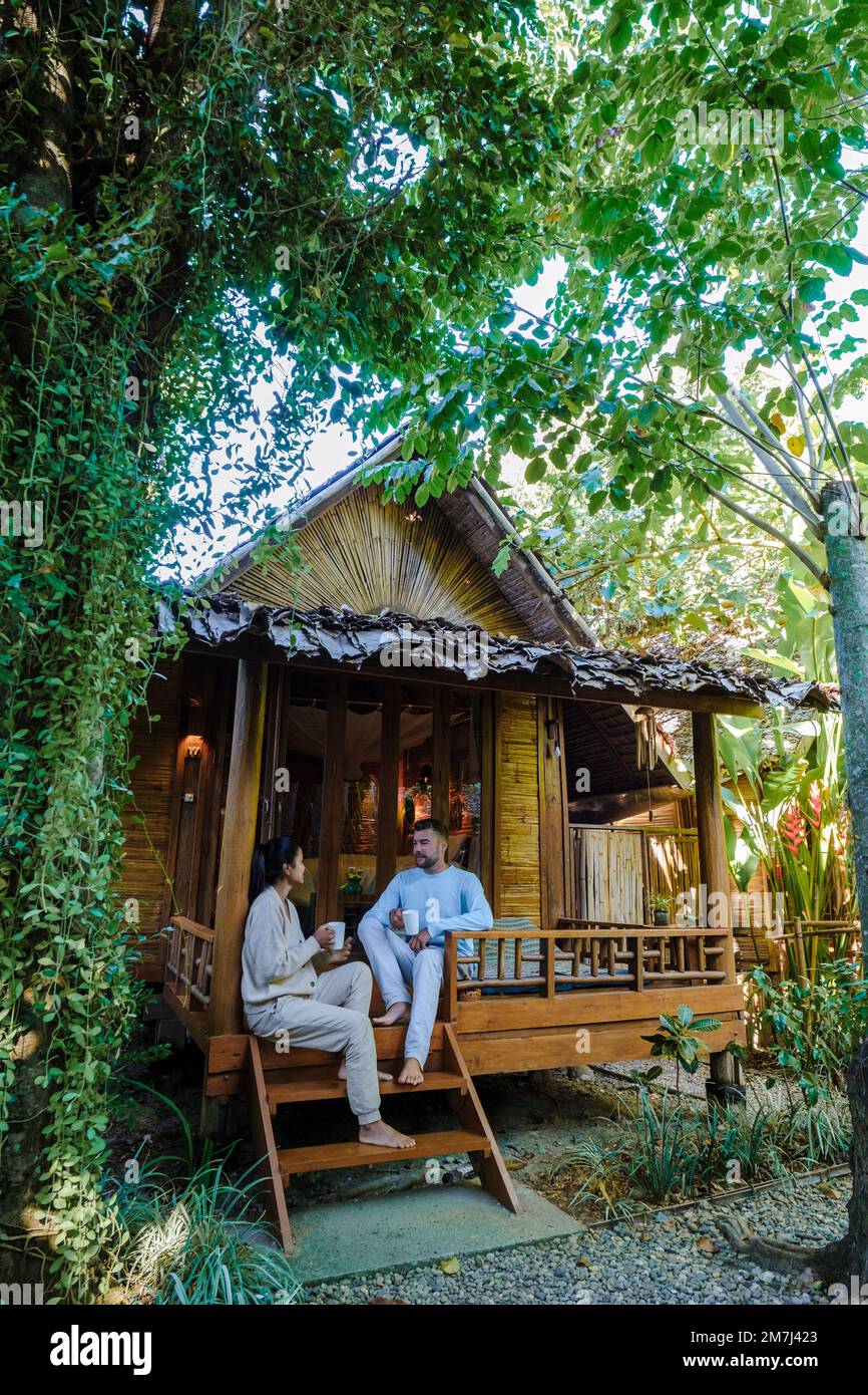 A couple of men and women at a cottage homestay in Northern Thailand ...