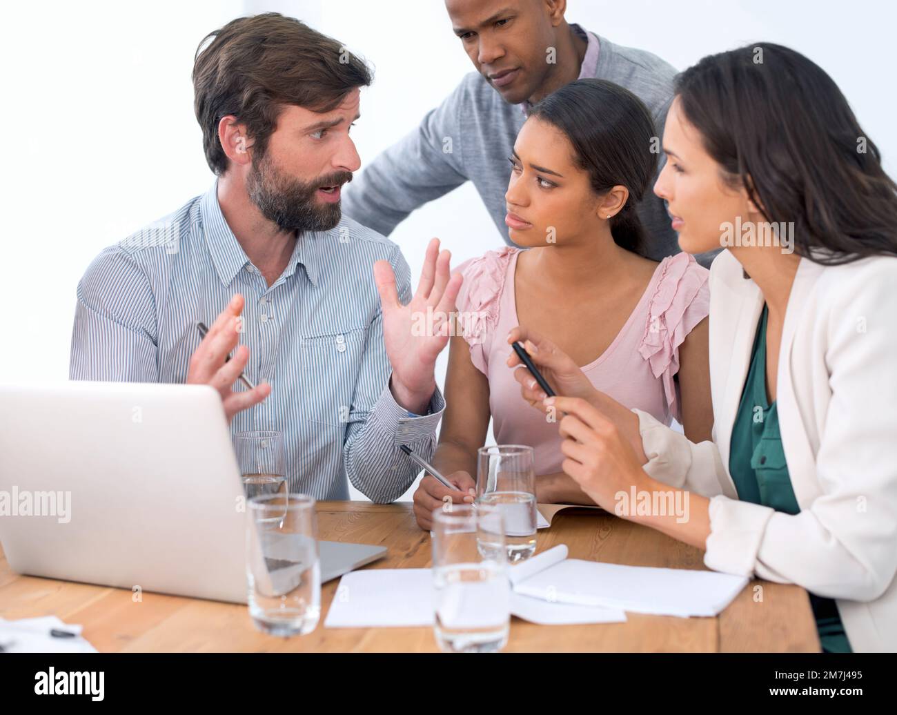 Explaining what he wants for his Company. a group of business people in ...