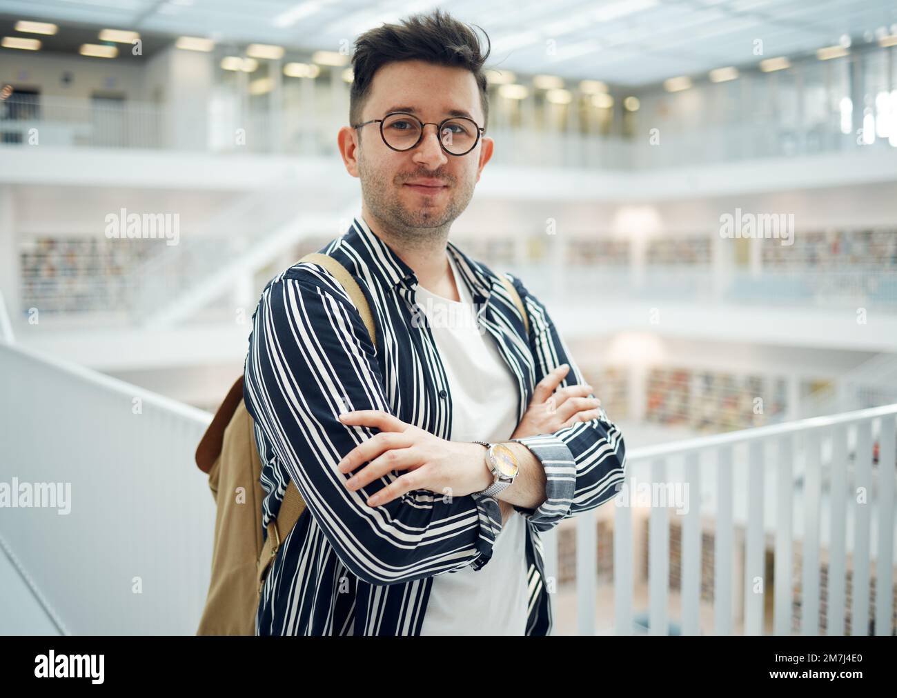University, portrait and man student in the library for studying ...