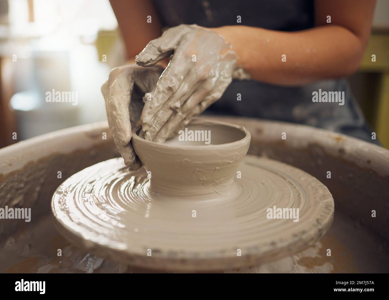 Hands, clay and pottery with a woman designer working in a studio or ...