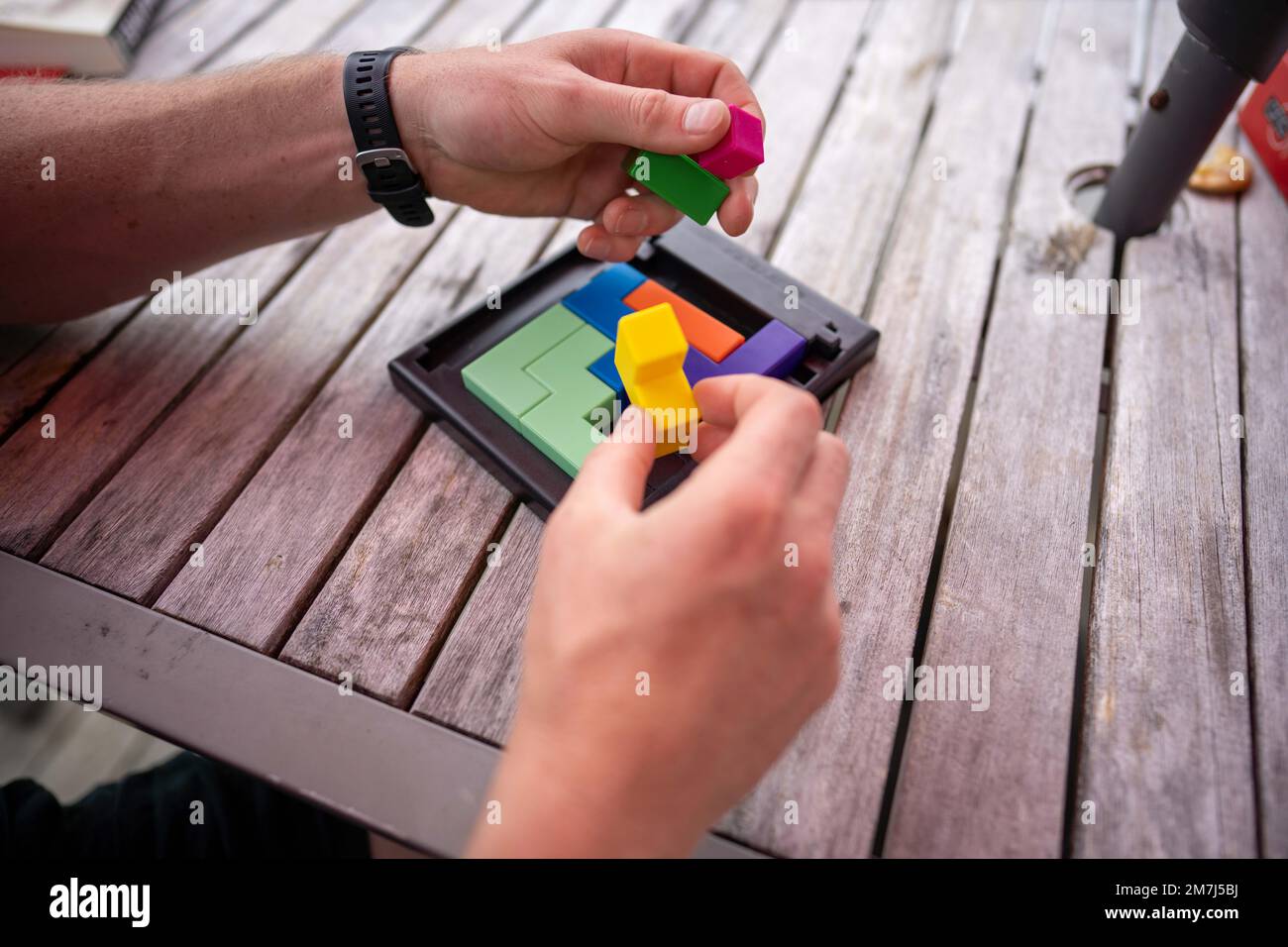 playing a puzzle game in the holidays with the family. block puzzle ...