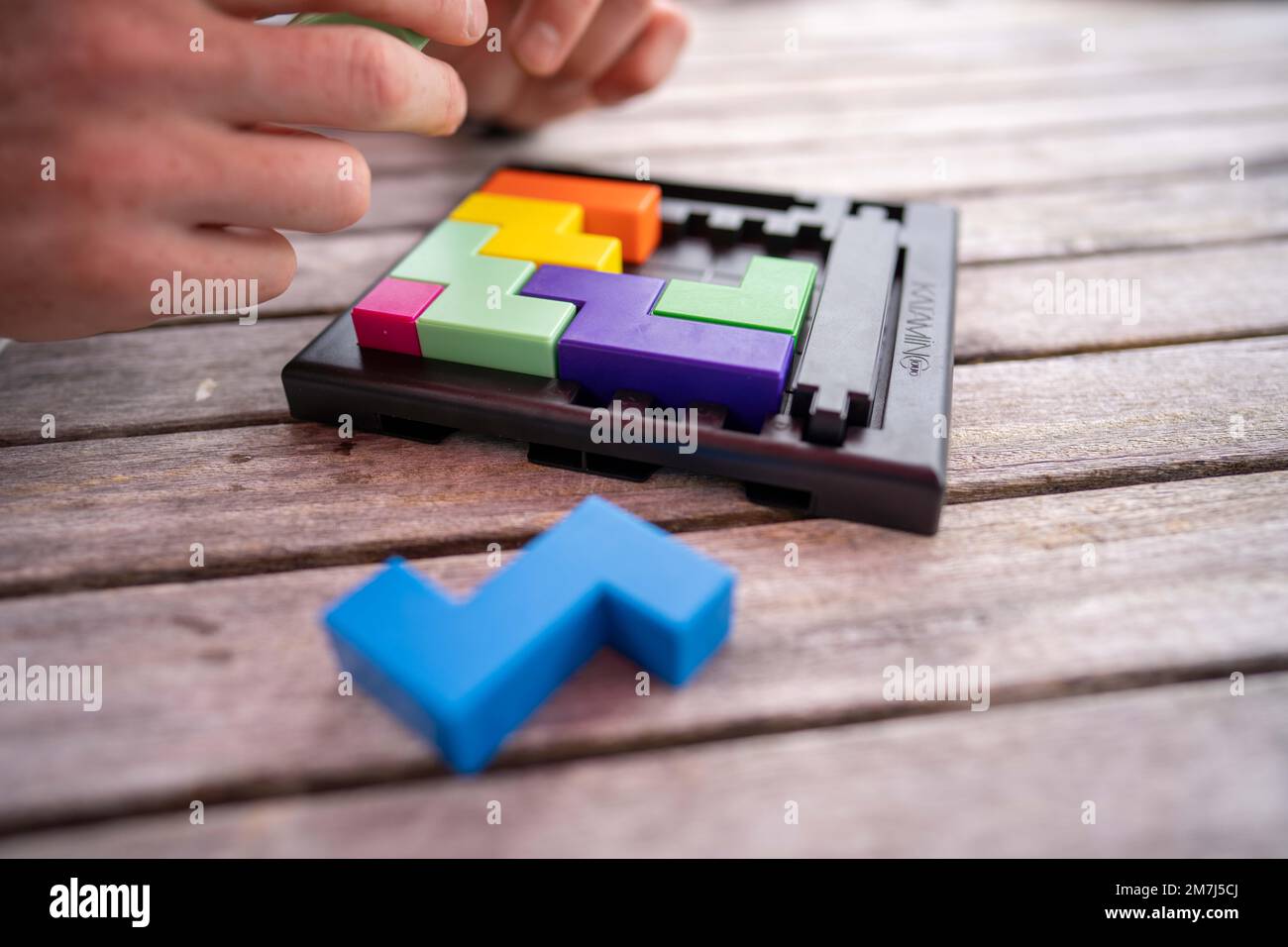 playing a puzzle game in the holidays with the family. block puzzle ...