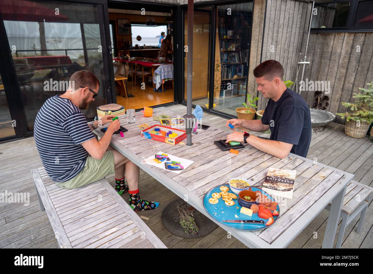 family playing board games at christmas. playing fun games Stock Photo ...