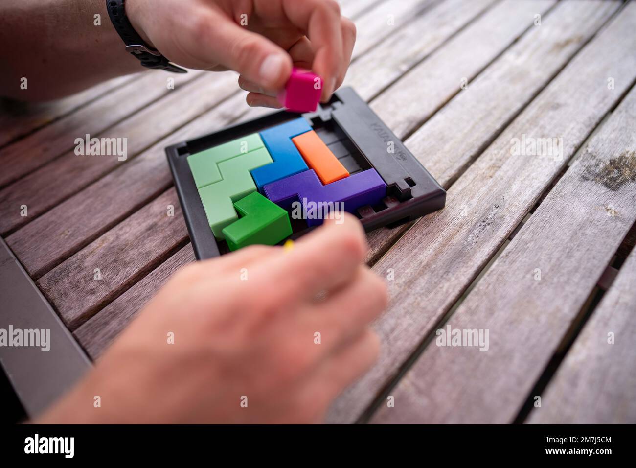 playing a puzzle game in the holidays with the family. block puzzle ...