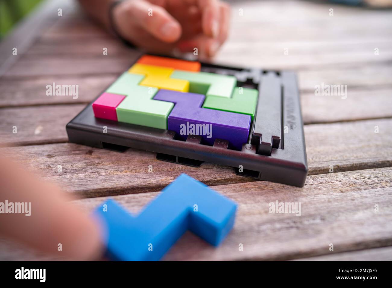 playing a puzzle game in the holidays with the family. block puzzle ...