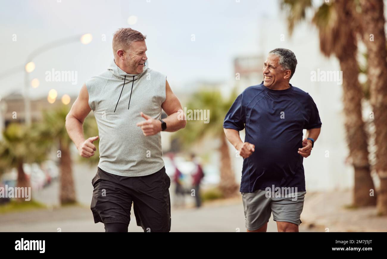 Running, men and fitness teamwork in city street, healthy lifestyle or ...