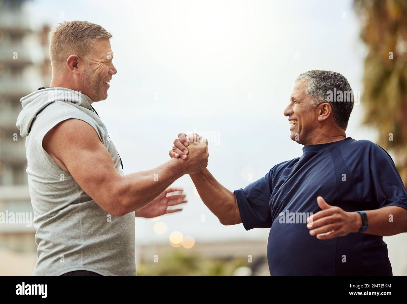 Old man, fitness and people handshake for health, lose weight or ...