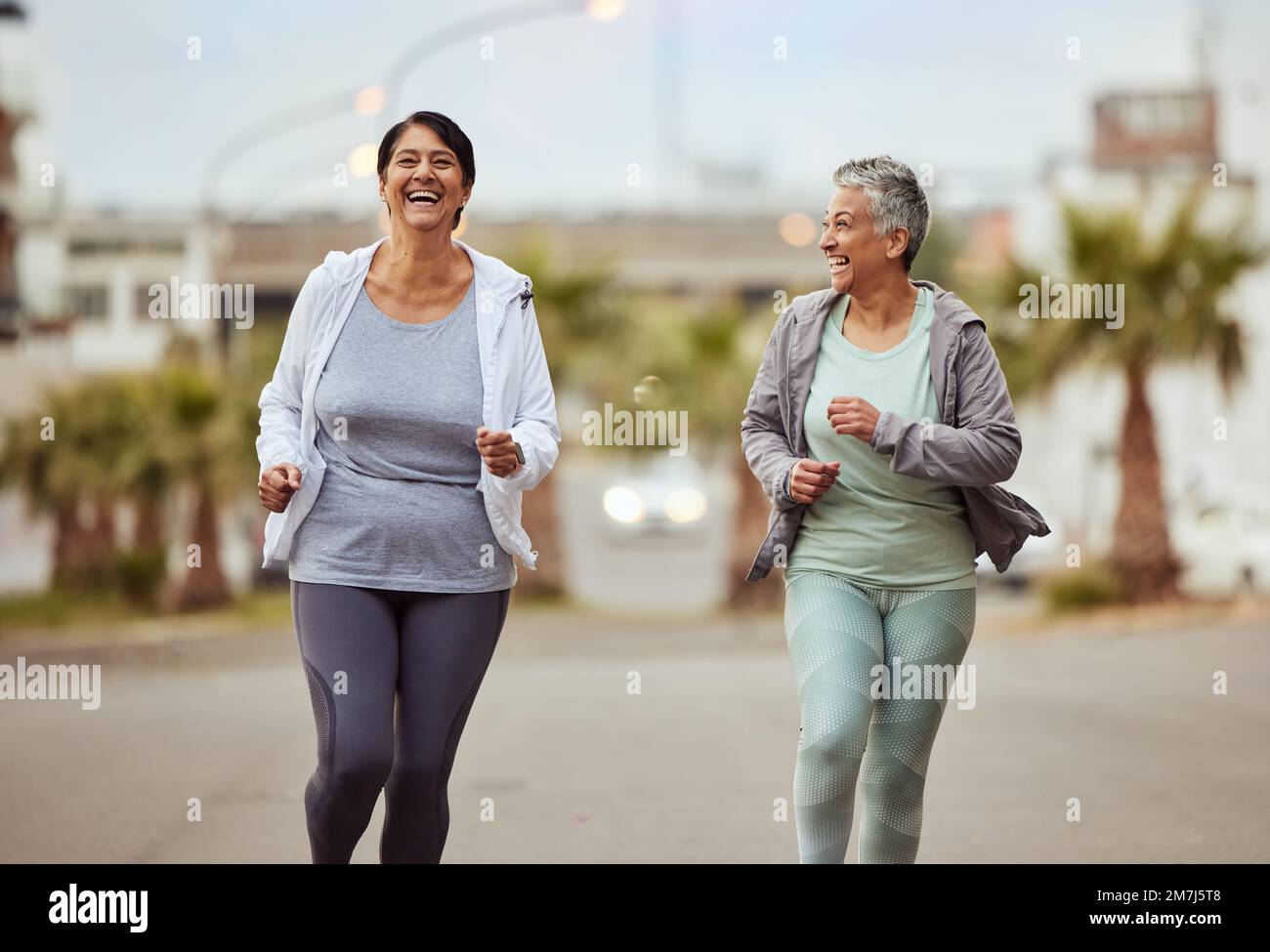 Fitness, city or friends running in a marathon challenge with sports ...