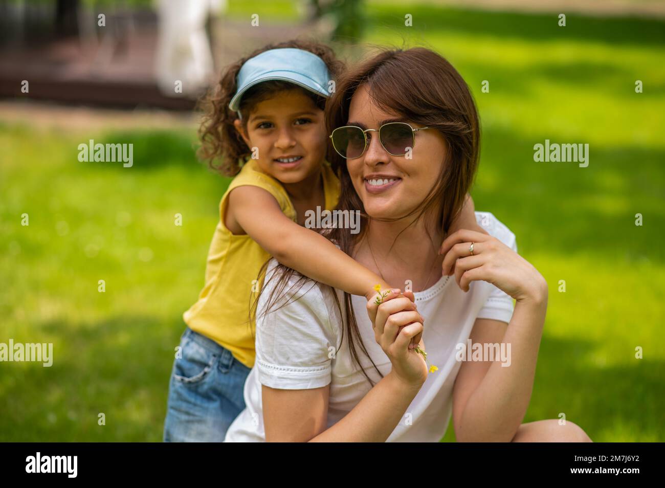 Mom and her cute kid spending time together and looking happy Stock ...