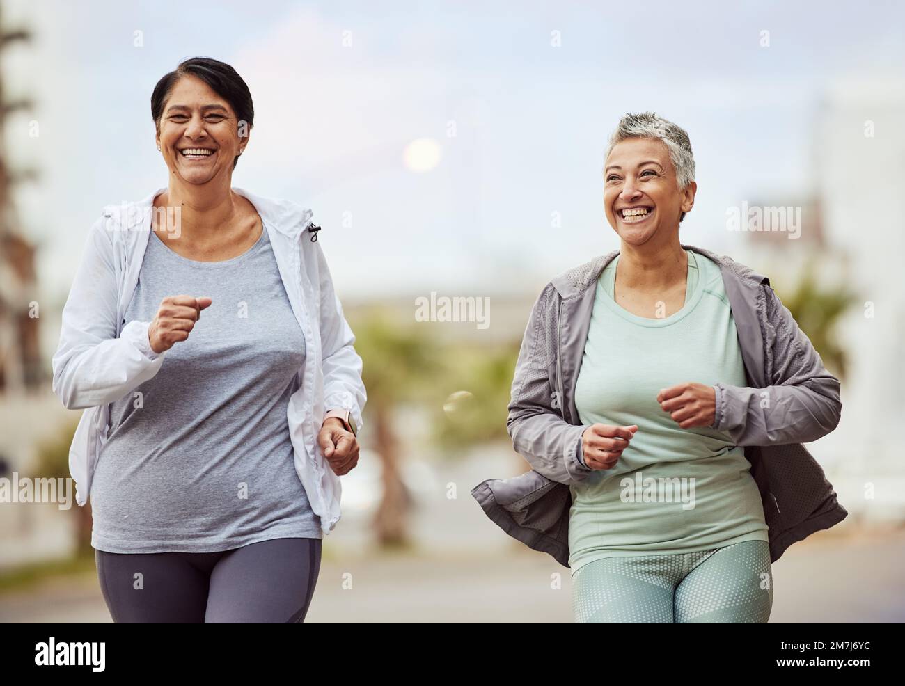 Fitness, city or senior friends running in a marathon challenge with ...