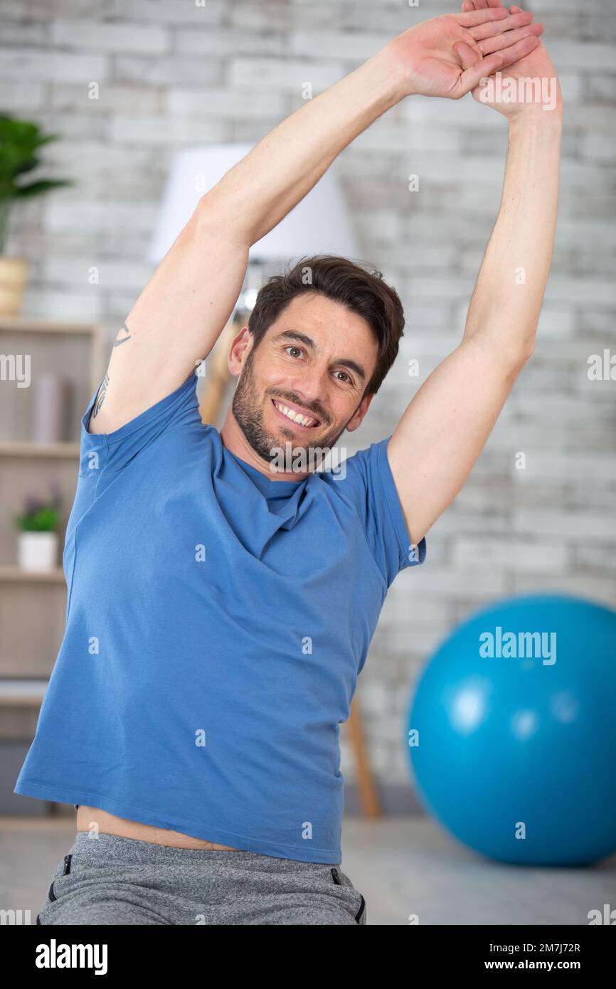 Man stretching above head hi-res stock photography and images - Alamy