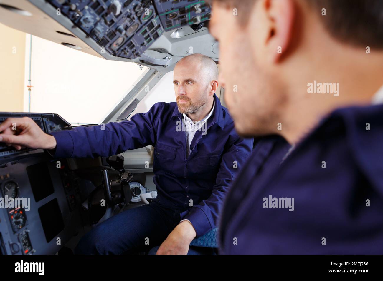 portrait of male aero engineer with clipboard working in cockpit Stock ...