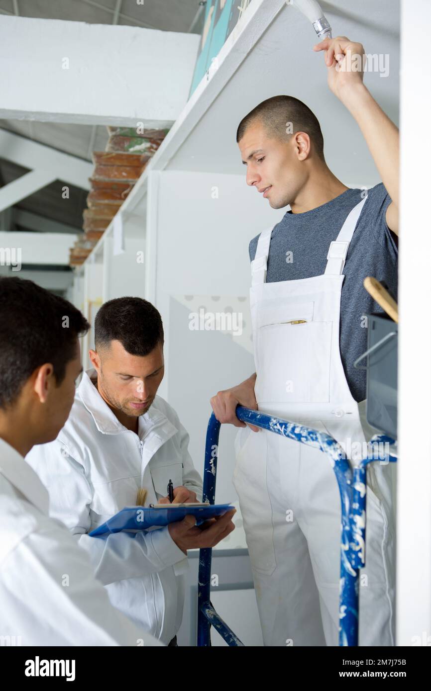 Two young painters painting hi-res stock photography and images - Alamy