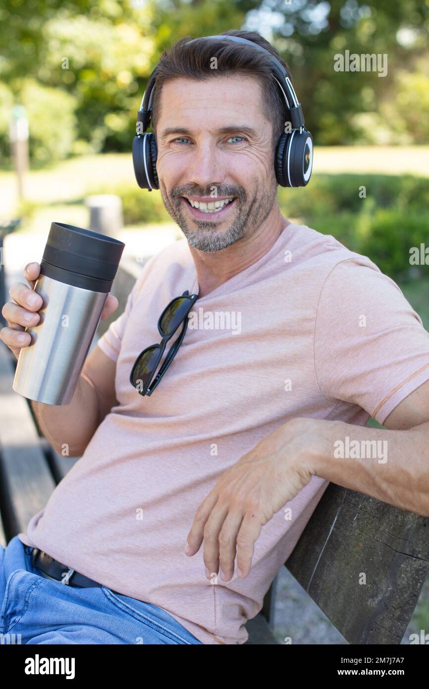 man on a park bench outdoors Stock Photo - Alamy