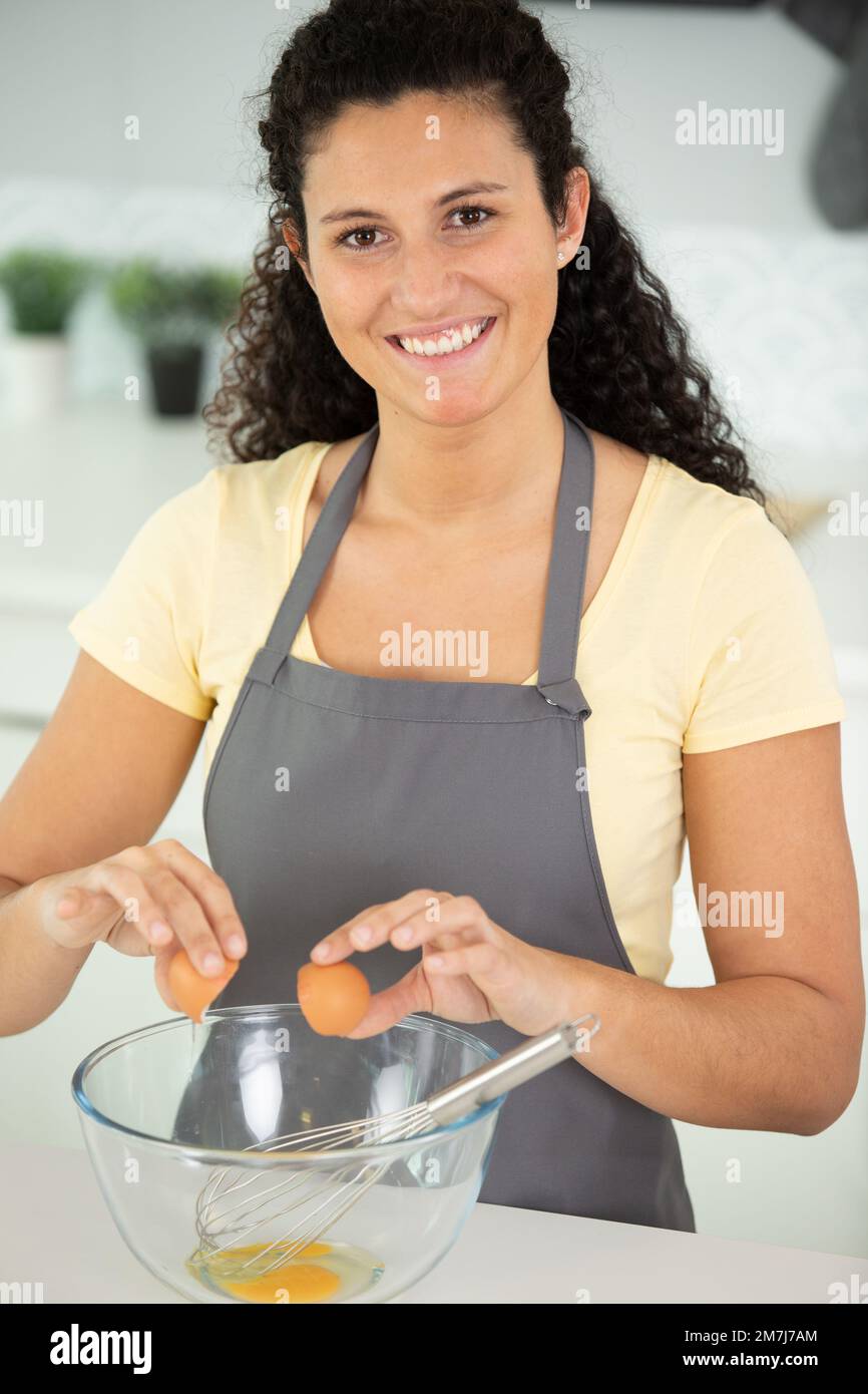 Woman breaks egg hi-res stock photography and images - Alamy