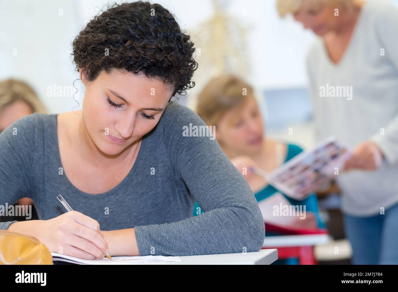 female college student sitting and exam in the classroom Stock Photo ...