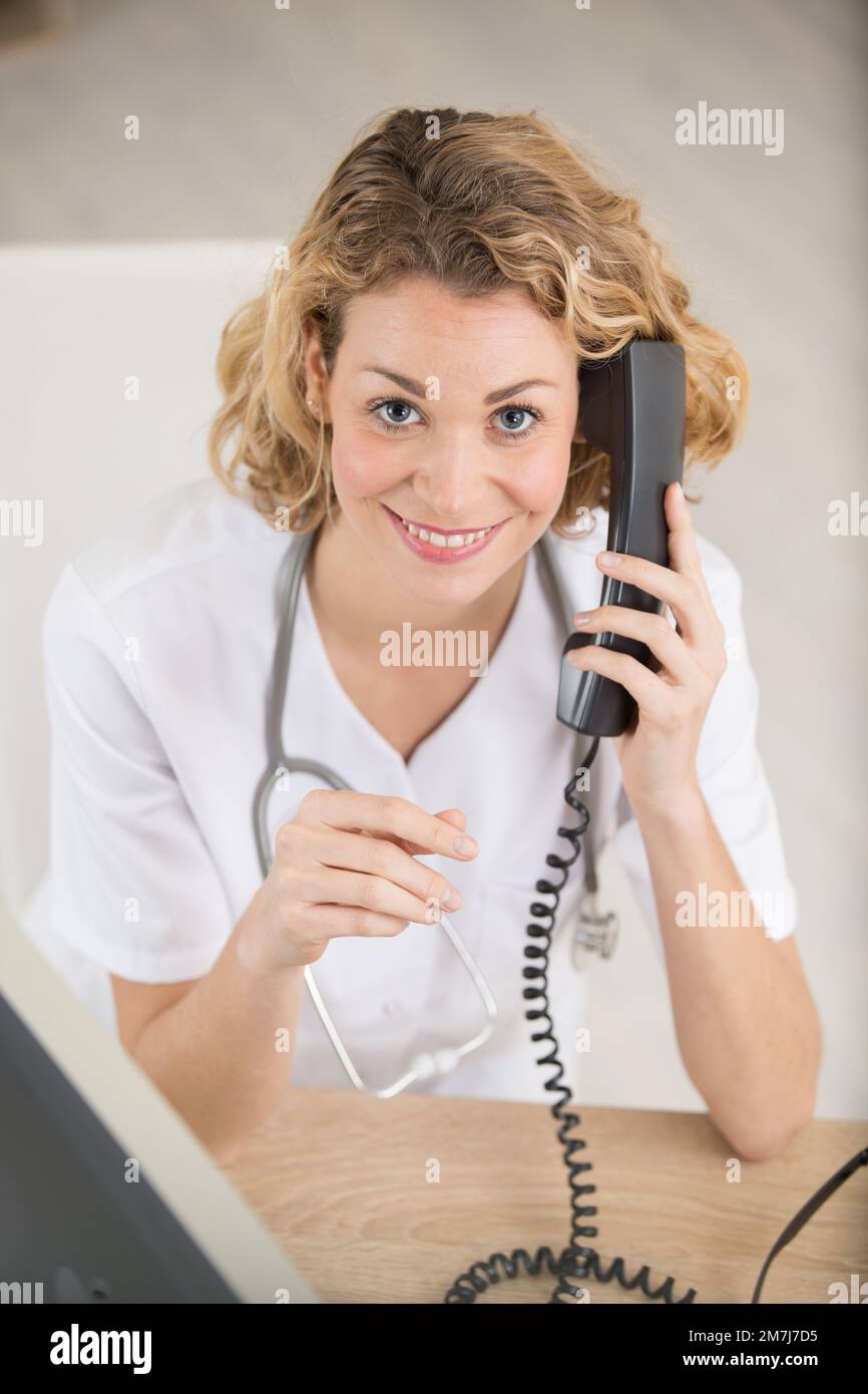 young practitioner doctor working at the clinic reception desk Stock ...