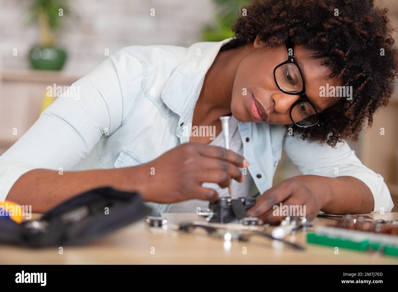 Female electronics engineer working on hi-res stock photography and ...