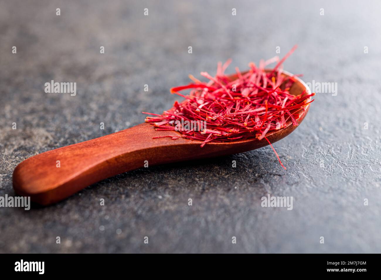 Dried saffron spice in the spoon Stock Photo - Alamy