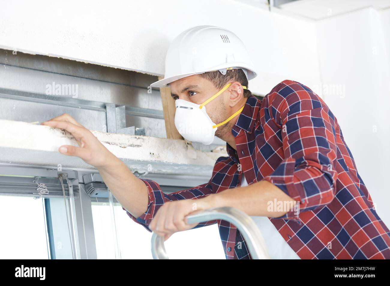 close-up portrait of a builder on a ladder Stock Photo - Alamy