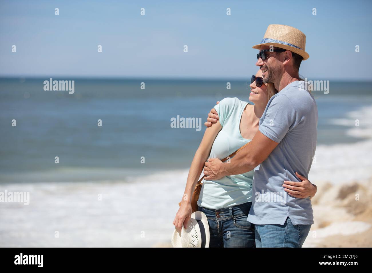 happy couple hugging on the beach Stock Photo - Alamy