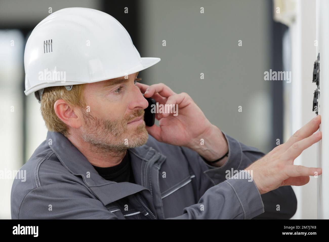foreman builder inspecting the electrical plugs Stock Photo - Alamy